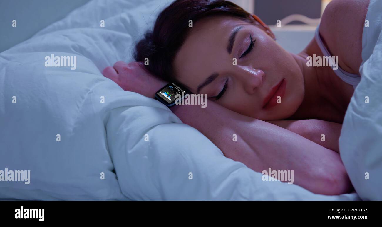 Wearable Sleep Tracking Heart Rate Monitor Smartwatch In Bed Stock ...