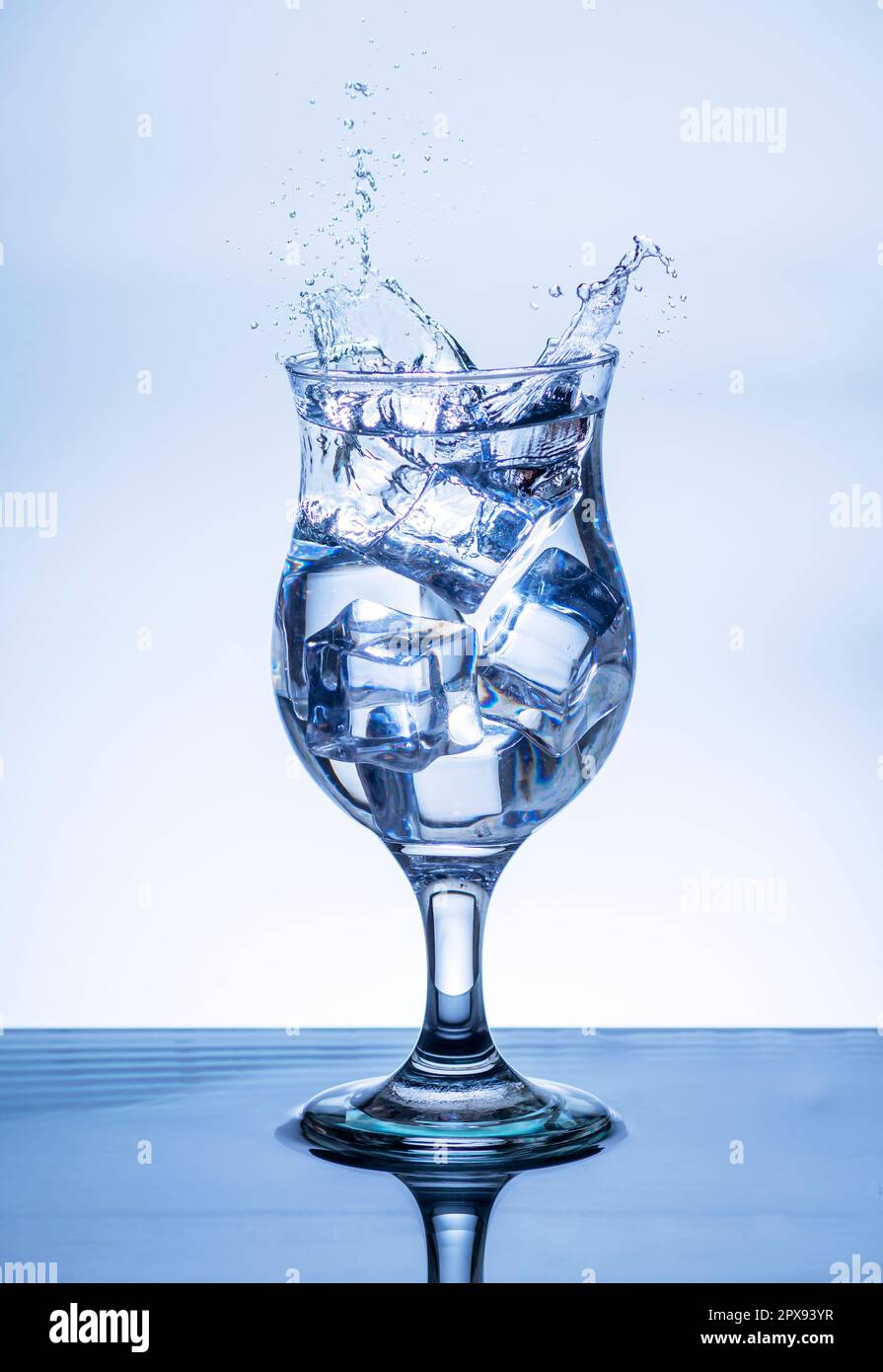 The image of pouring drinking water, into a broken glass, that makes ...