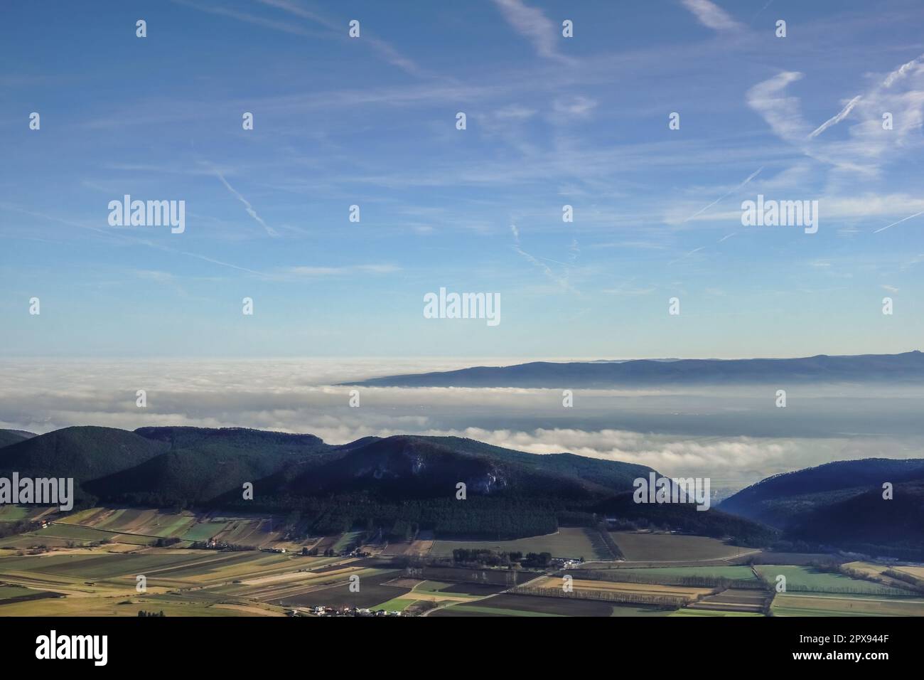 very dense fog in the valley during hiking in the sunshine and blue sky ...
