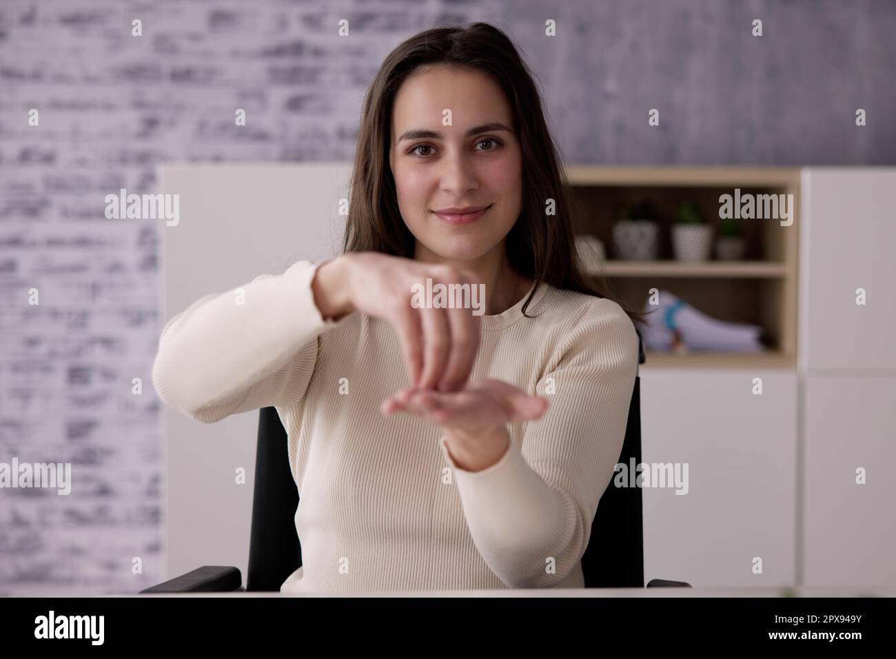 Adult Learning Sign Language For Deaf Disabled Stock Photo - Alamy