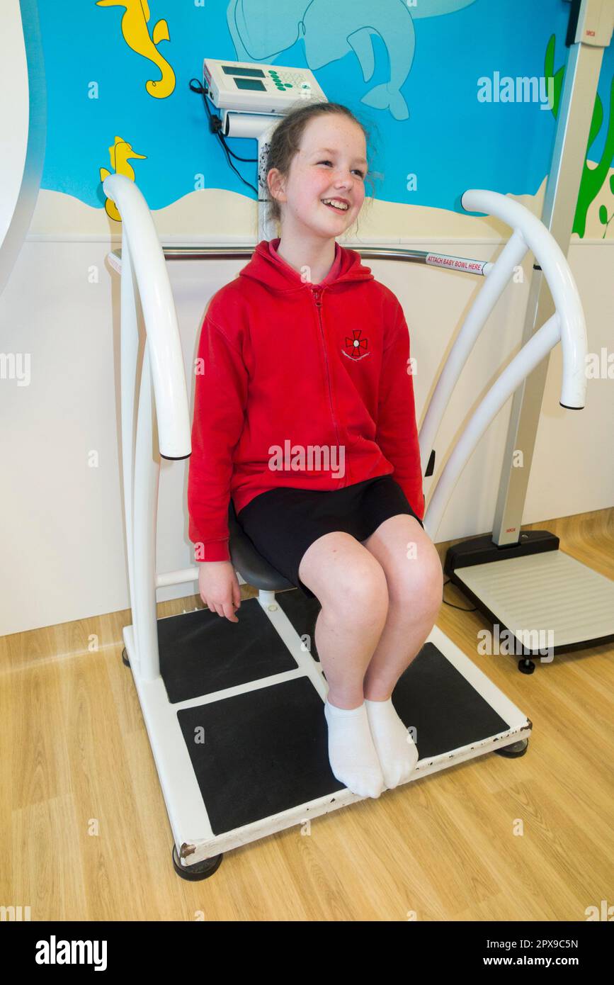 Eleven / 11 year old girl in a paediatric hospital setting having her ...