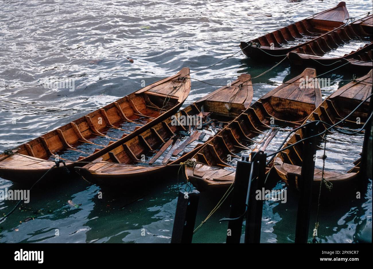 Scanned slide of a historical color photograph of wooden boats flooded ...