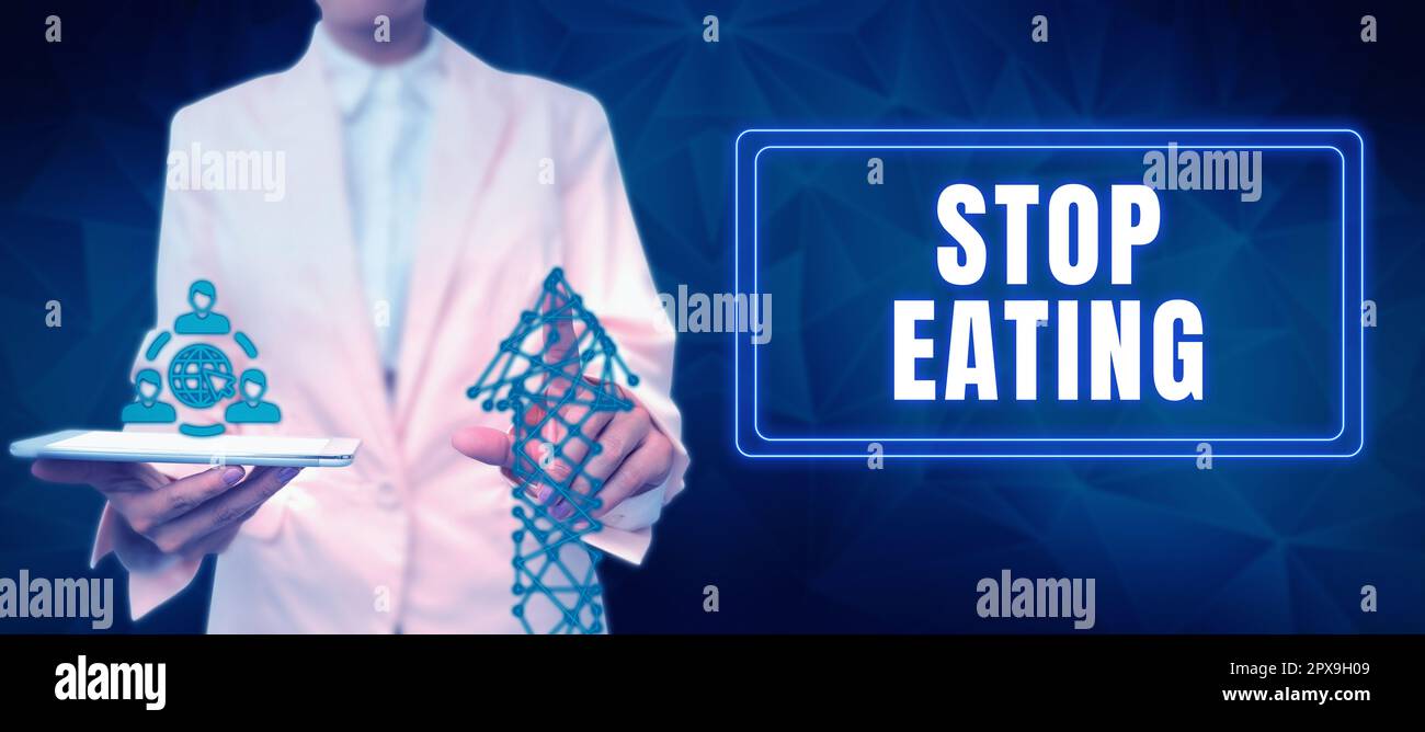 Putting food into his mouth hi-res stock photography and images - Alamy