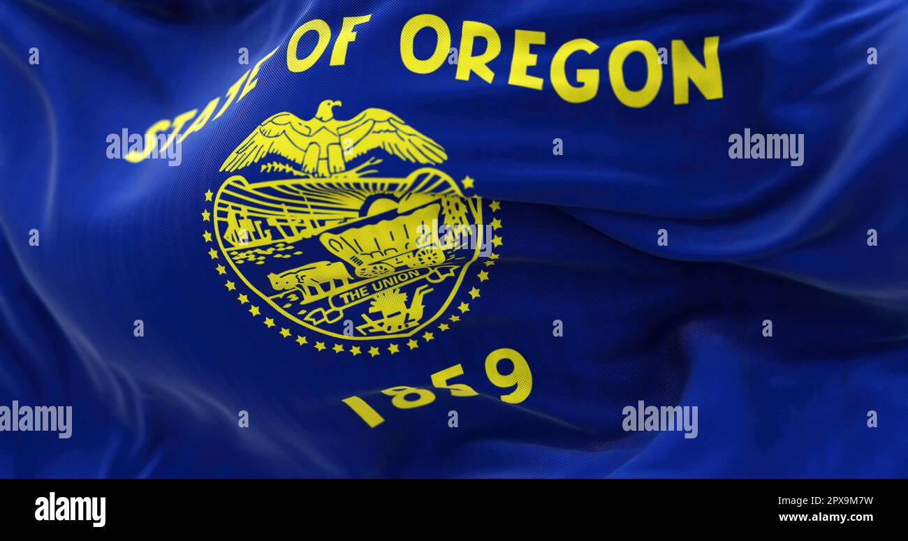 Close-up of the Oregon state flag waving. Oregon is a state in the ...