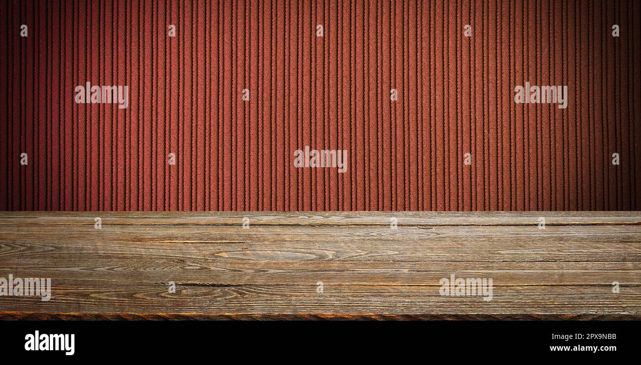 The background is blank wooden boards and a textured striped wall with ...