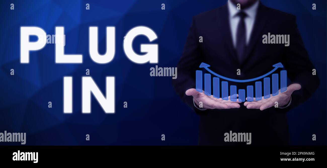 Hand writing sign Plug In, Word Written on putting device into ...