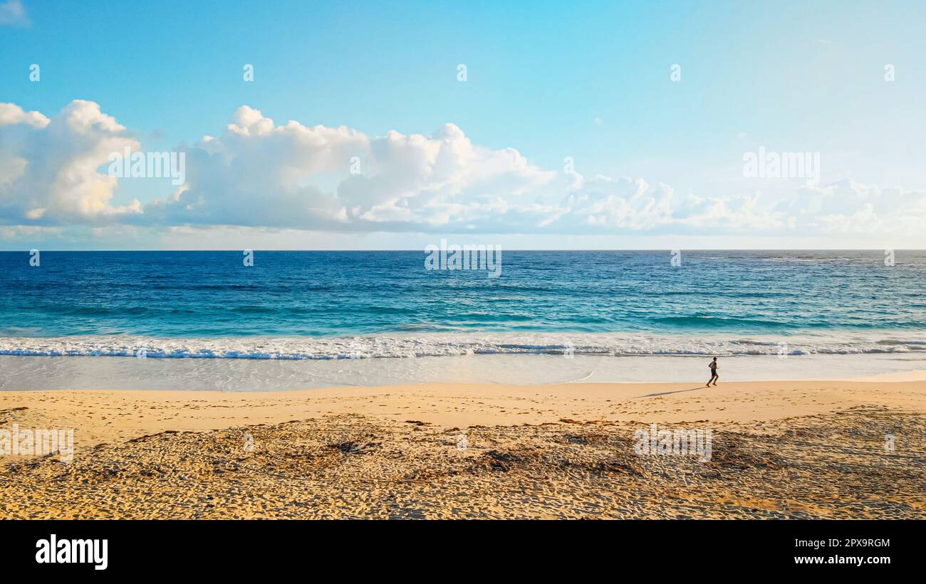 Runner by the sea. Man running along ocean coast. Run along coast of ...