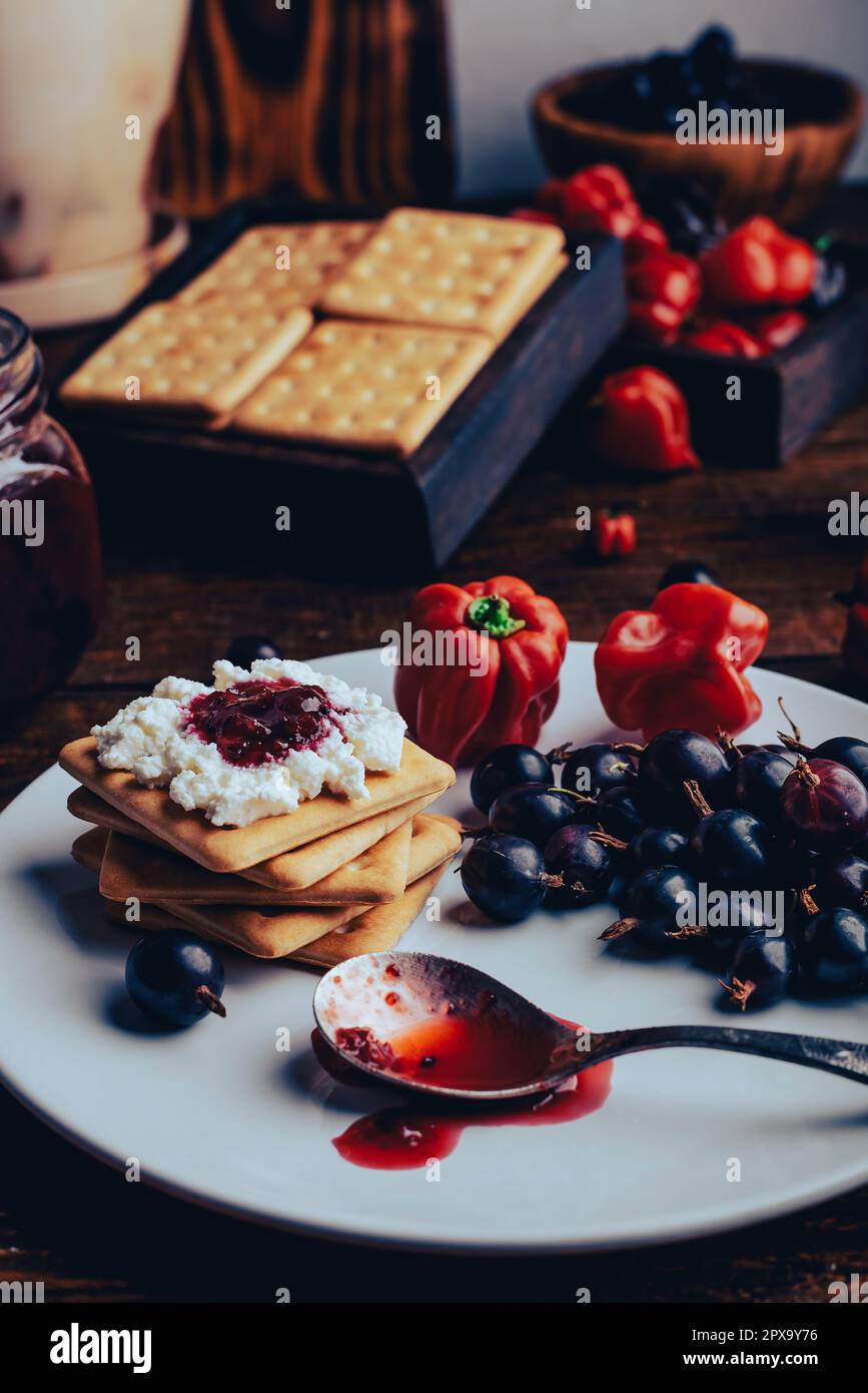 Square Crackers with Cream Cheese and Gooseberry and Chili Pepper Jam ...