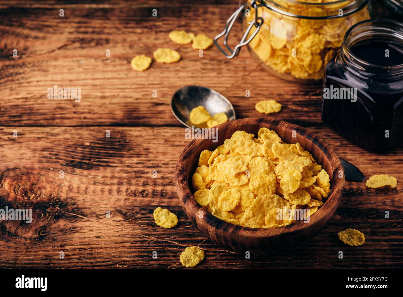 Breakfast with corn flakes, milk and berry jam Stock Photo - Alamy