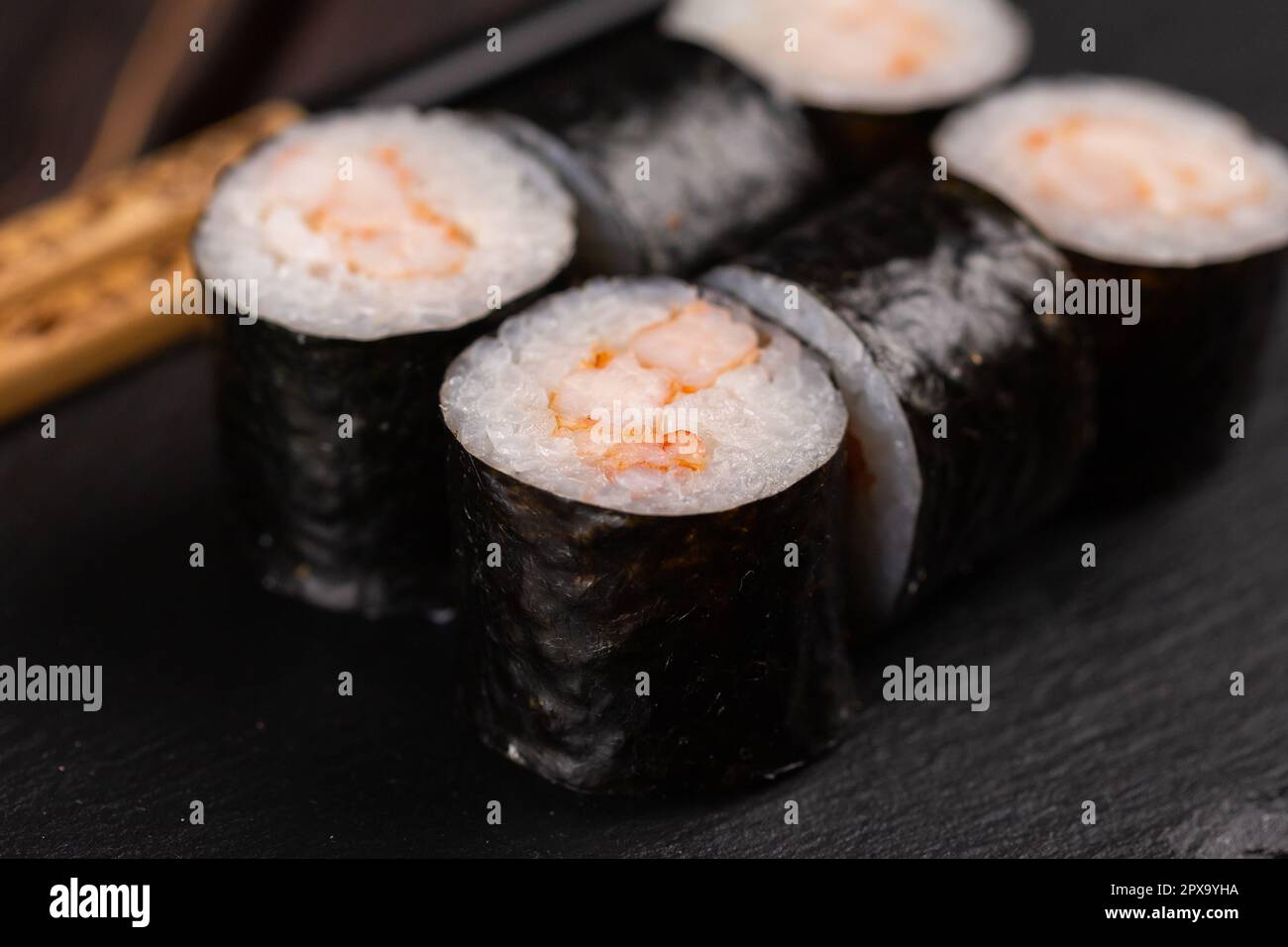 Maki shrimp sushi. Shrimp fillet stuffing wrapped in rice and nori ...