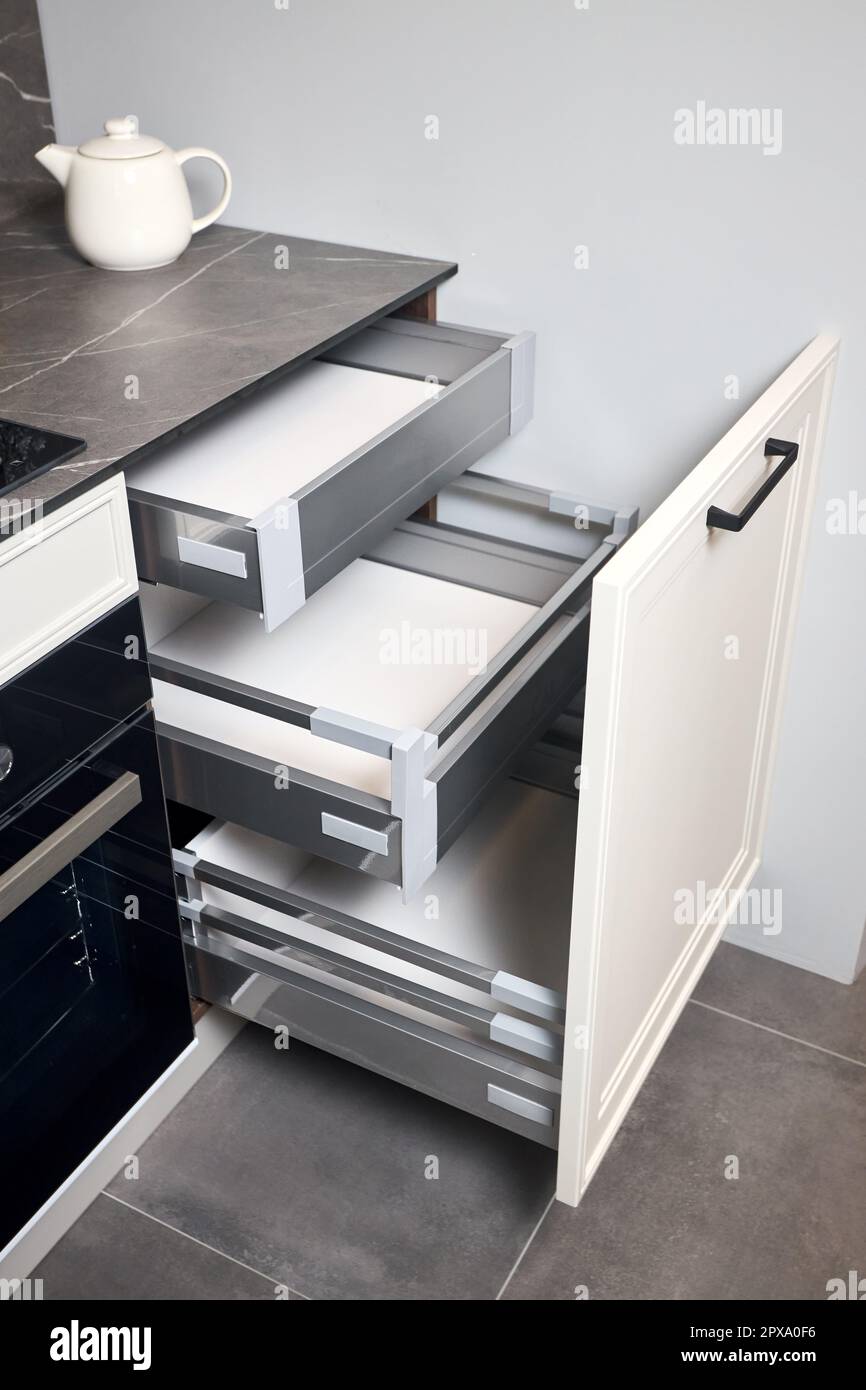 Gas cooker black glass and iron hob on marble light stoneware ...