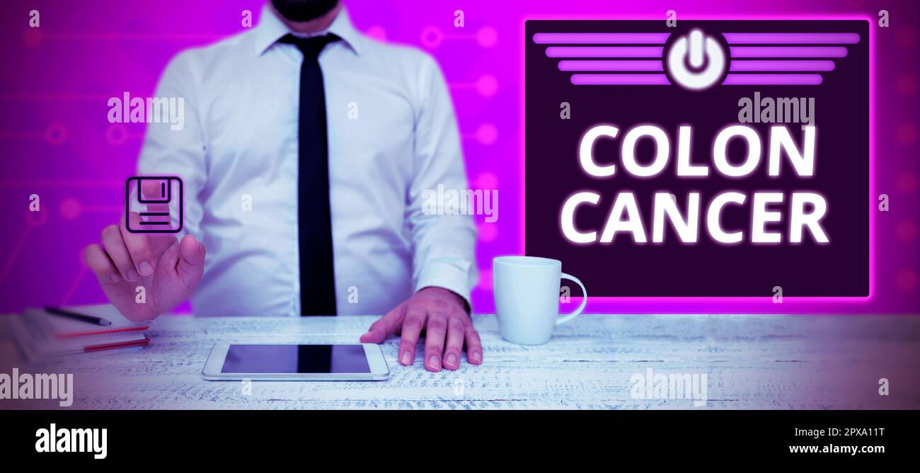 Hand writing sign Colon Cancer, Word for Cancer that forms in the ...