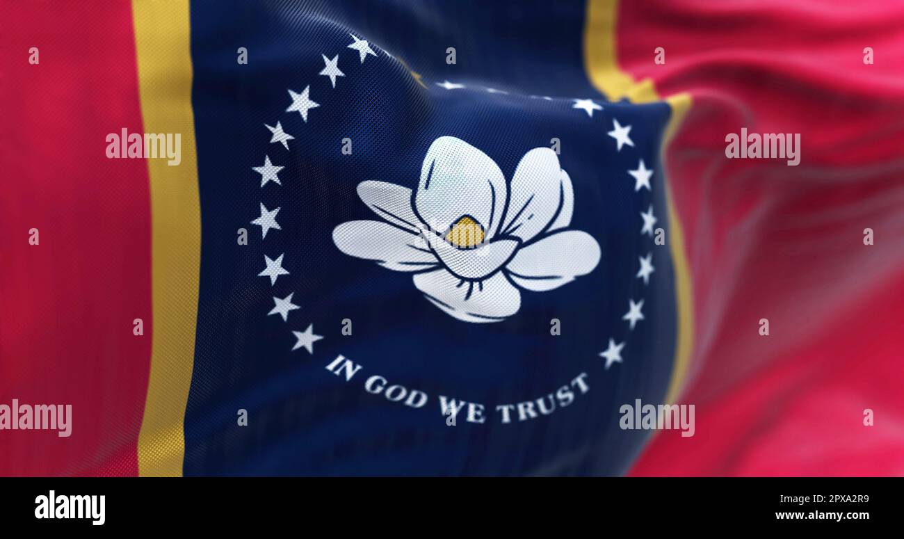 Detail of the Mississippi flag waving. White magnolia, 21 stars, In God ...