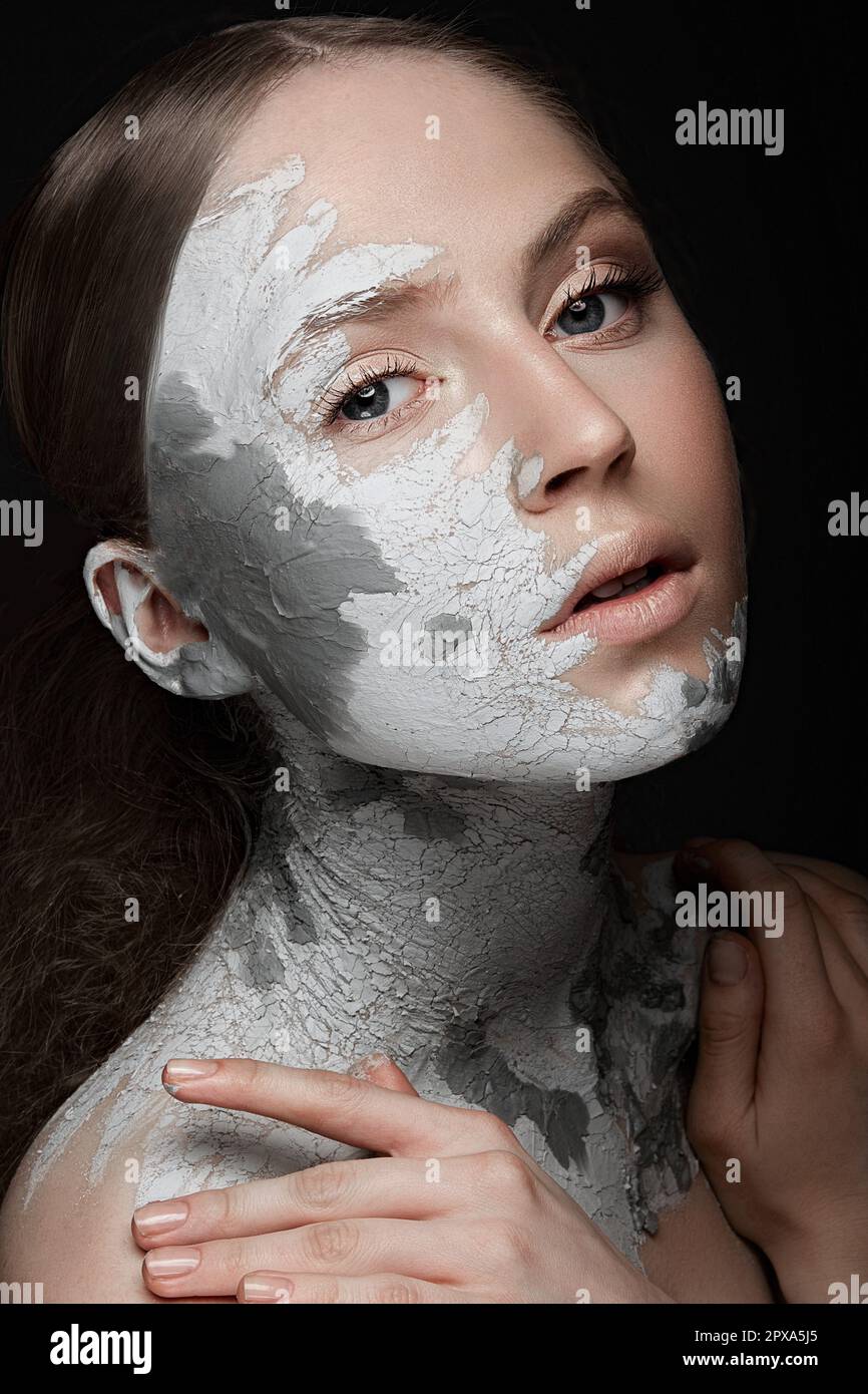 Beautiful girl with mud on his face. Cosmetic mask. Beauty face ...