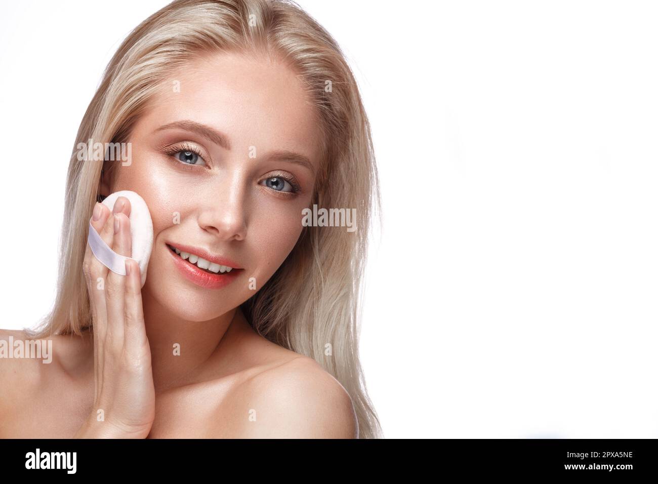 Beautiful young girl with a light natural make-up and perfect skin ...