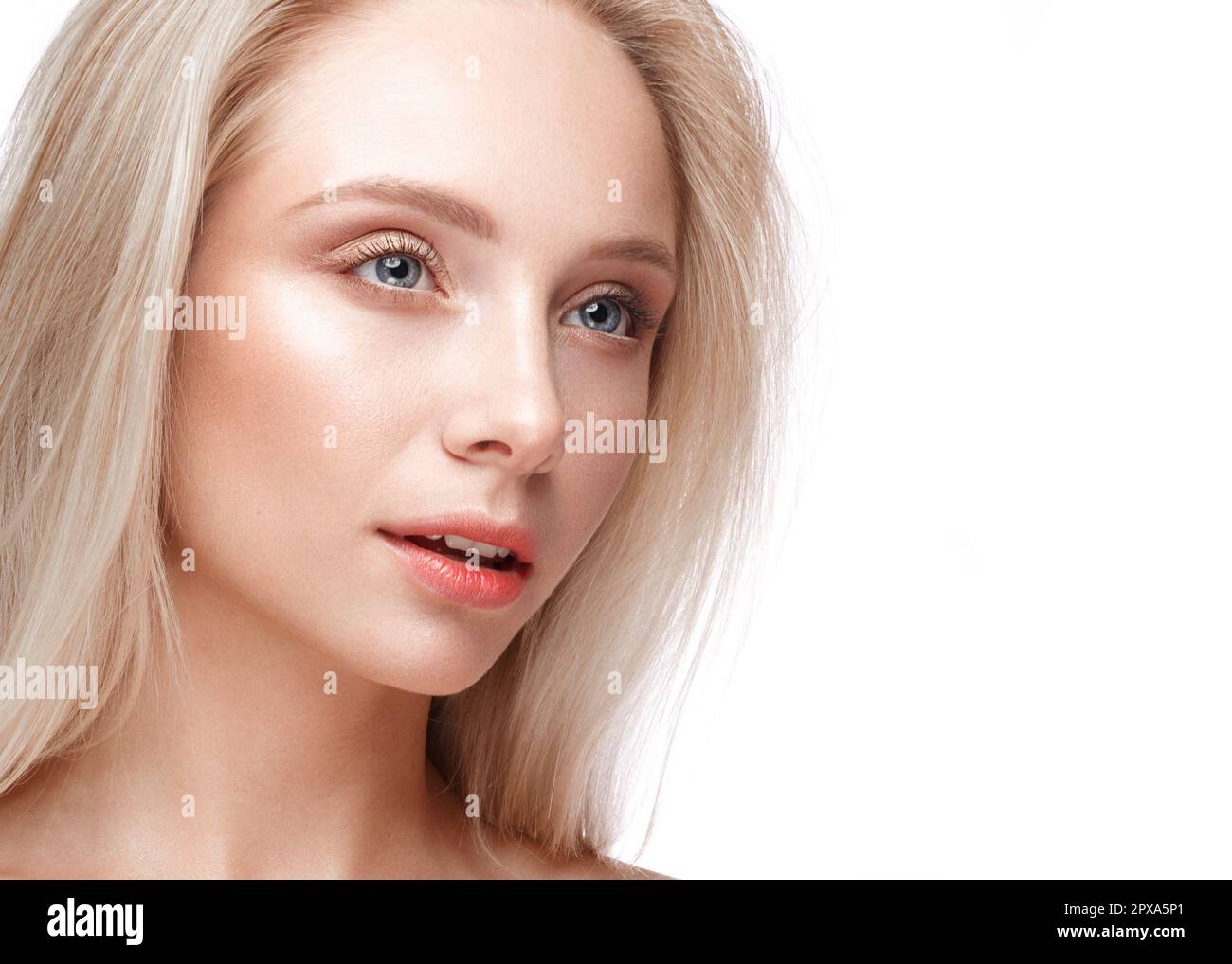 Beautiful young girl with a light natural make-up and perfect skin ...
