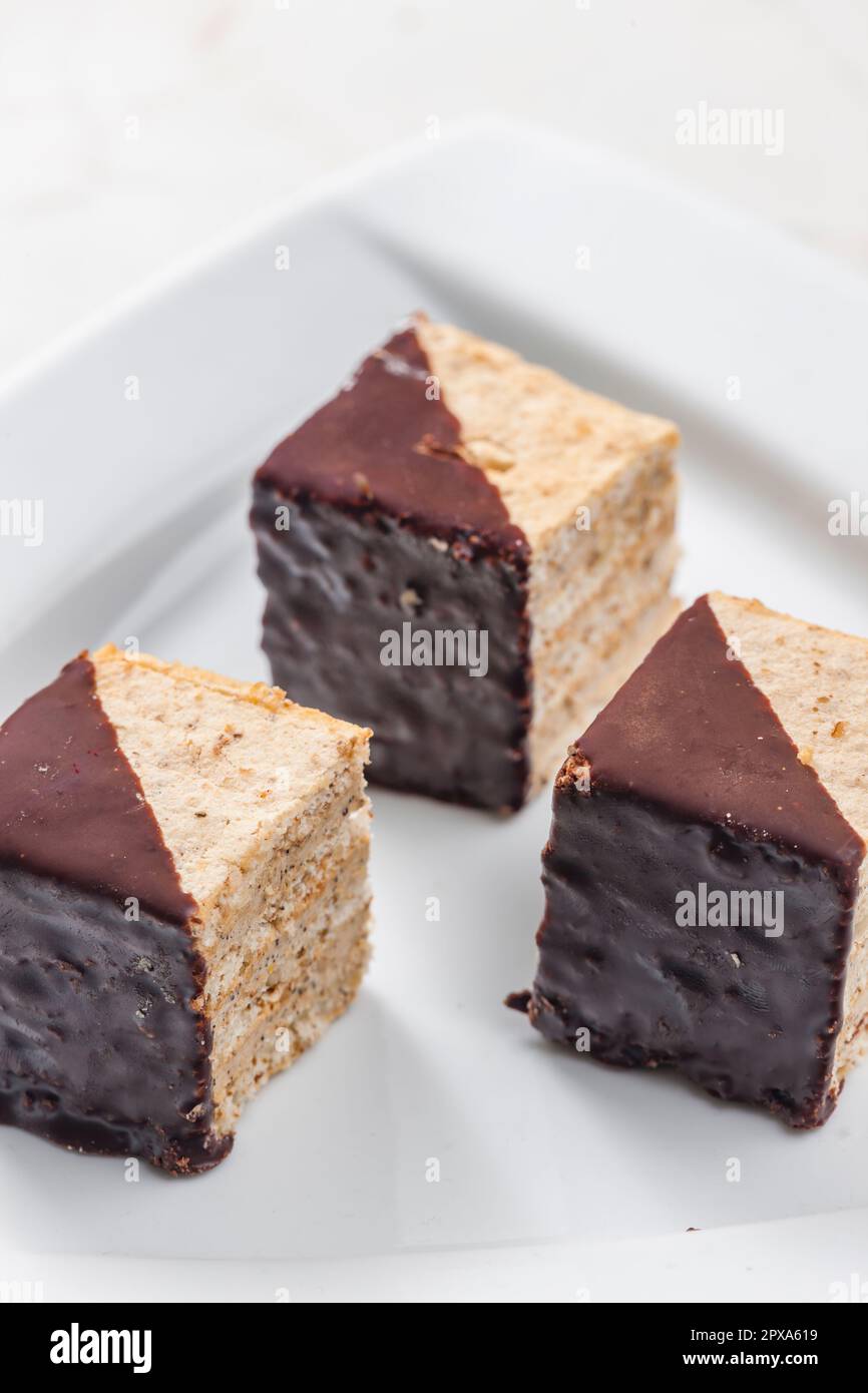 nutty sponge cakes with chocolate coating Stock Photo - Alamy