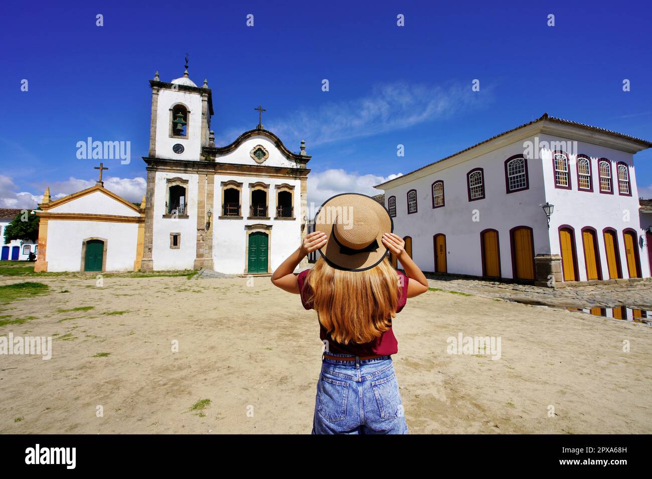 Tourism in Brazil. Young woman visiting the historic town of Paraty ...