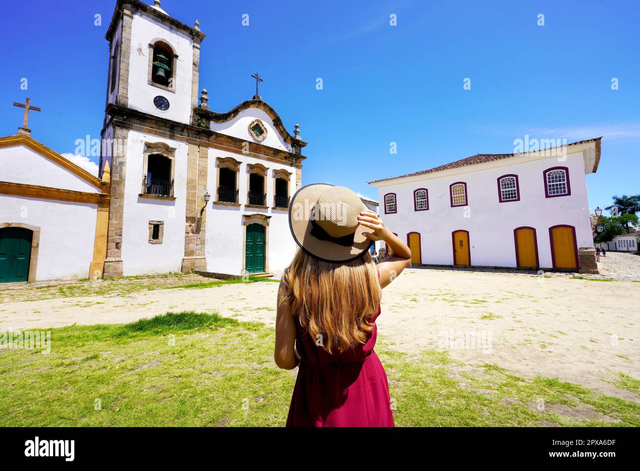 Holidays in Brazil. Young woman visiting the historic town of Paraty ...