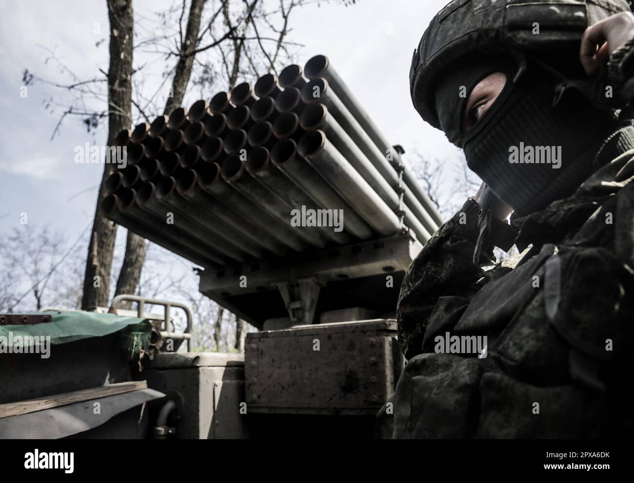 April 28.2023 Russia. Donetsk region. A soldier from the calculation of the multiple rocket ...