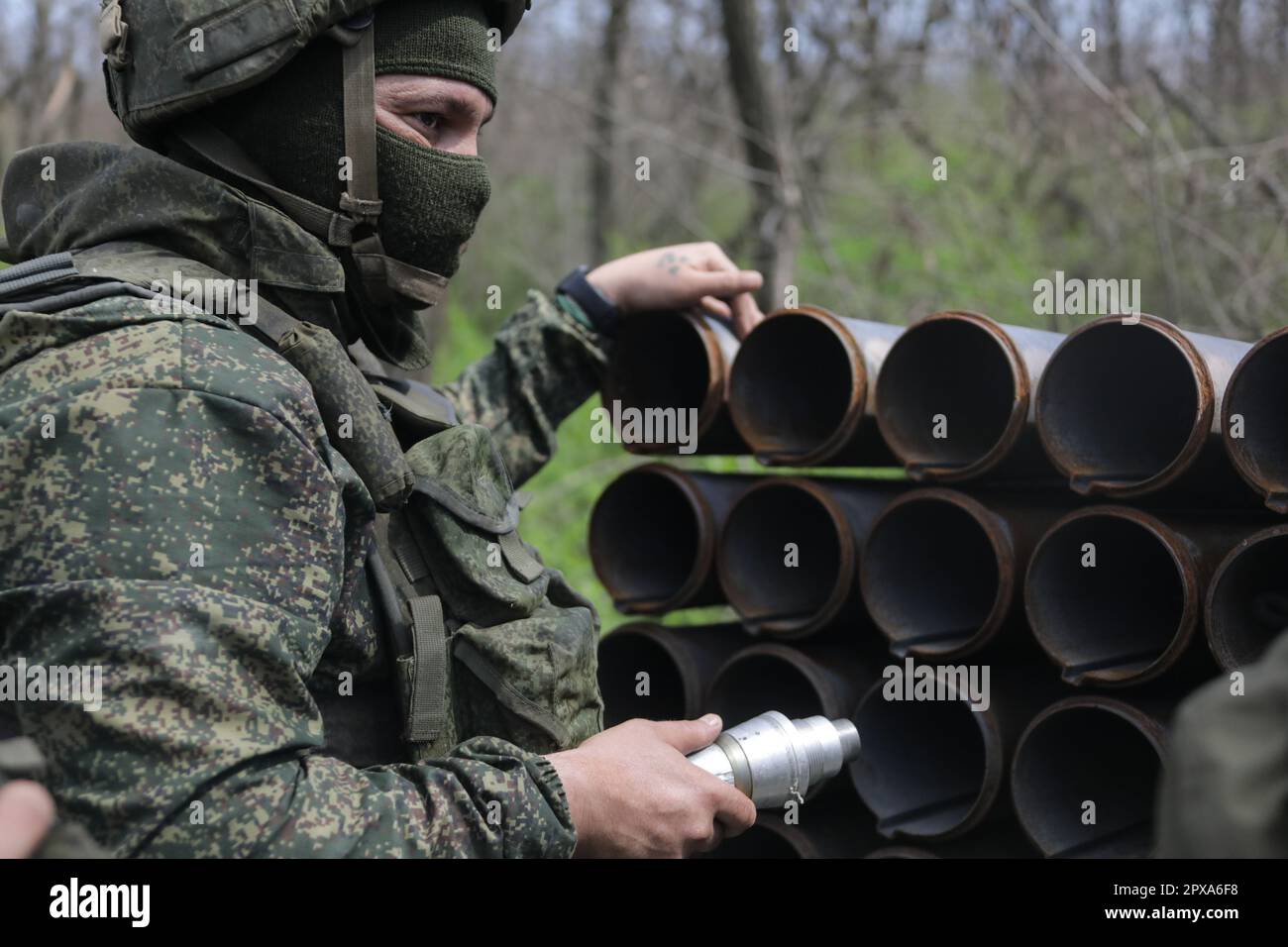 April 28.2023 Russia. Donetsk region. A soldier from the calculation of the multiple rocket ...