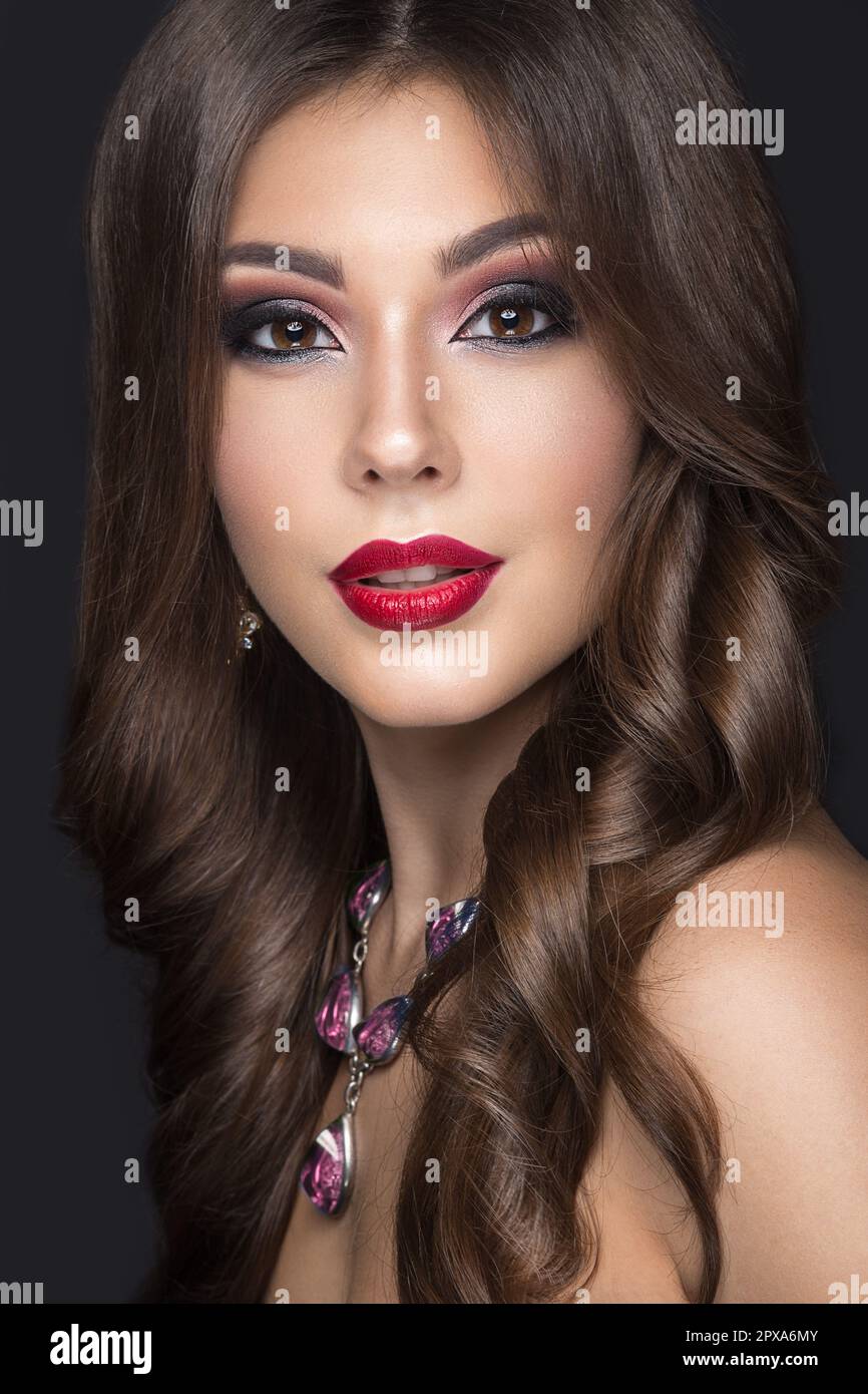Beautiful woman with arabic make-up, red lips and curls. Beauty face ...