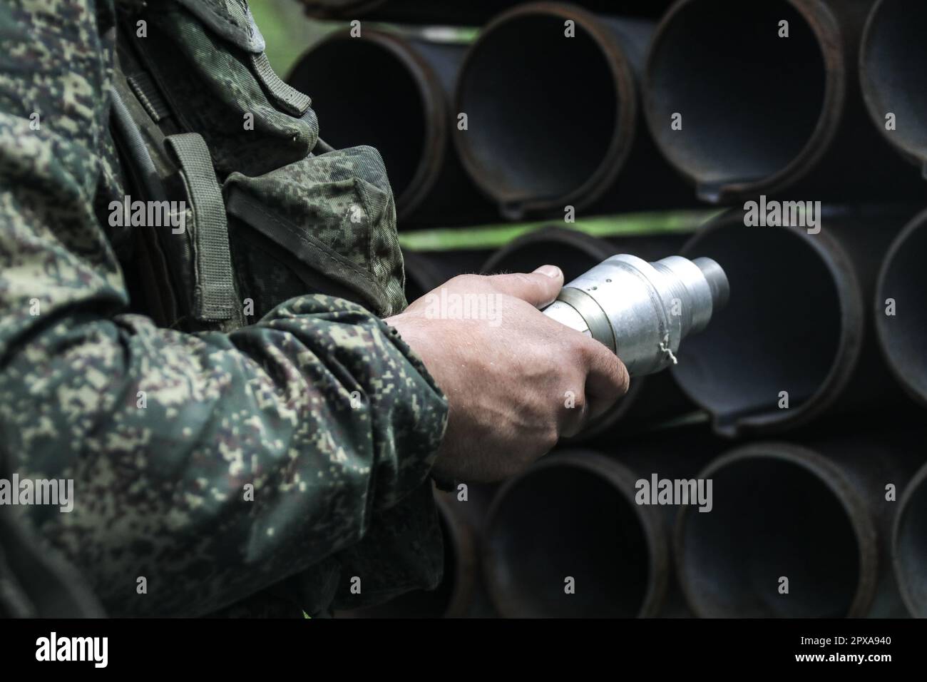 April 28.2023 Russia. Donetsk region. A soldier from the calculation of the multiple rocket ...