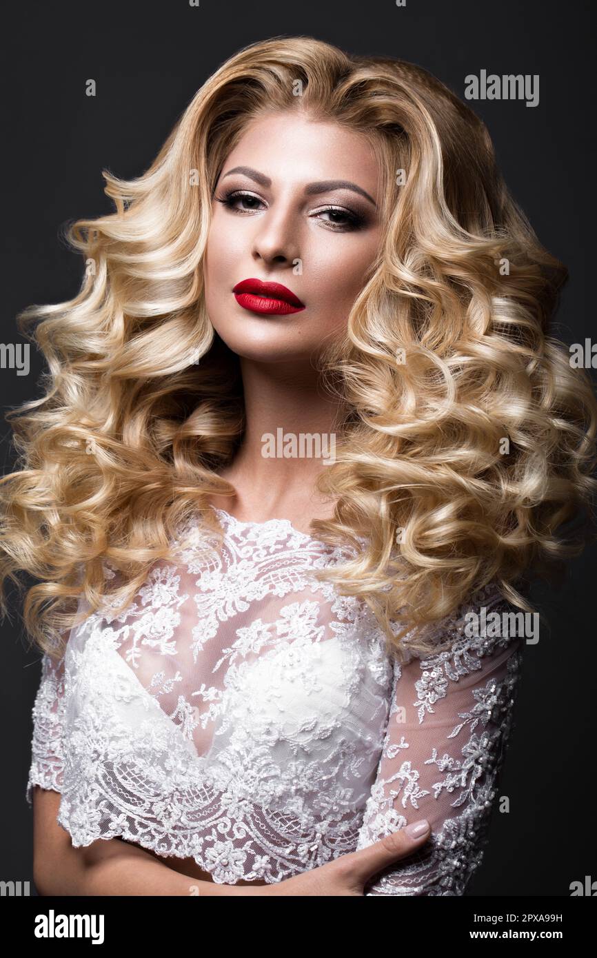 Beautiful blonde bride in wedding image with curls, red lips. Beauty ...