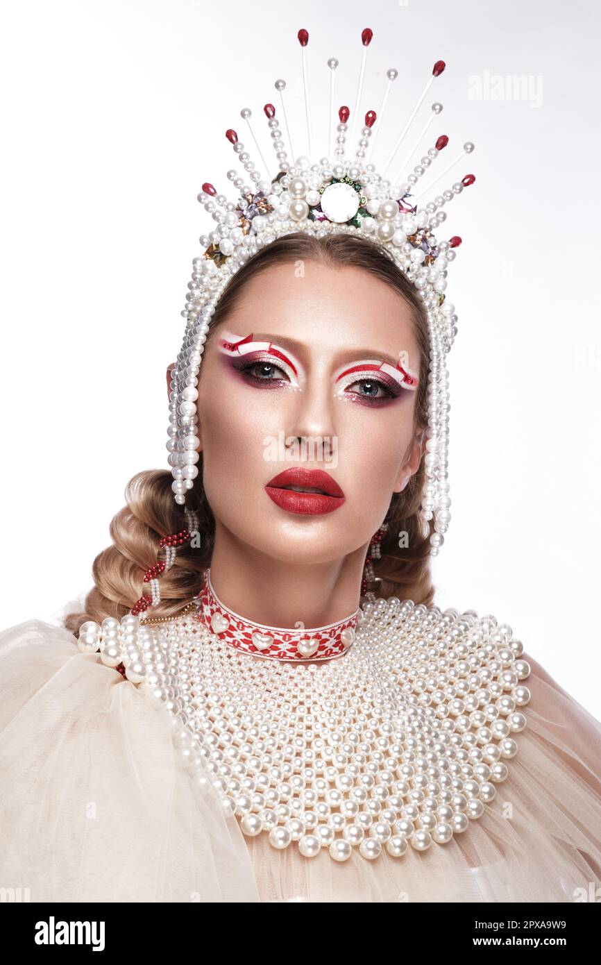 Beautiful woman in a creative style with bright makeup and white ...