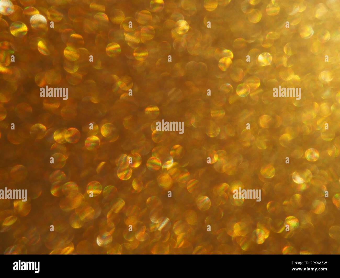 Bokeh light of gold glitters. Golden glitter texture background ...