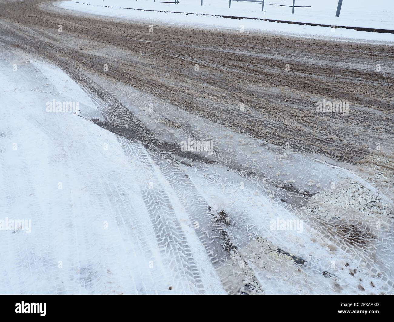 A fork or siding from a roundabout. Snowdrifts on the side of the road ...