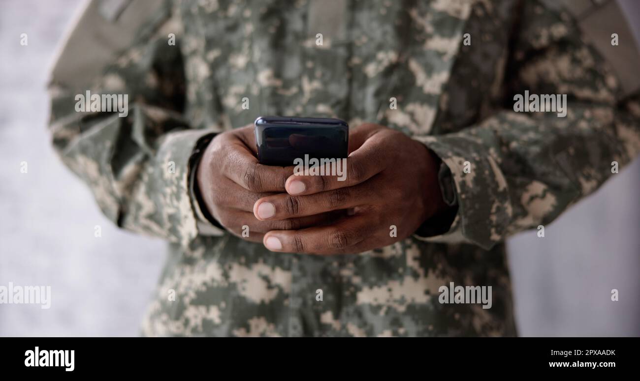 US Military Soldier Smart Phone Espionage. Cyber War Stock Photo - Alamy