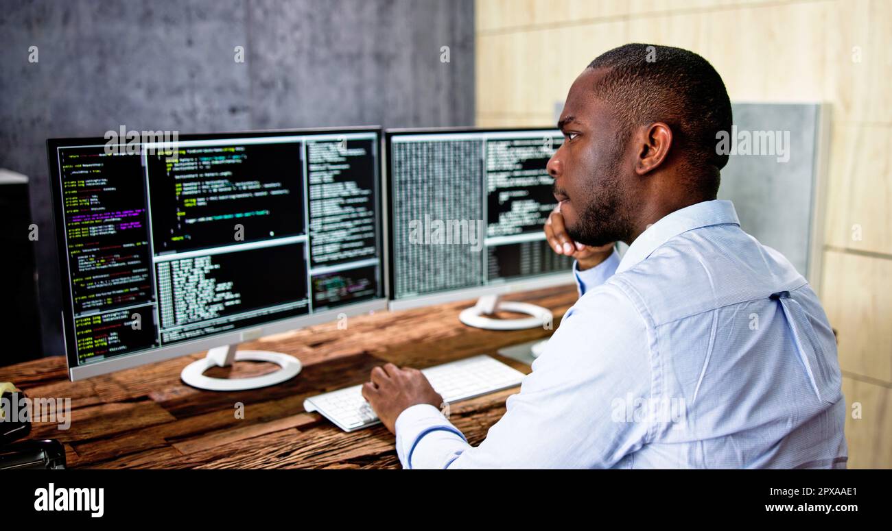 African American Coder Using Computer At Desk. Web Developer Stock ...
