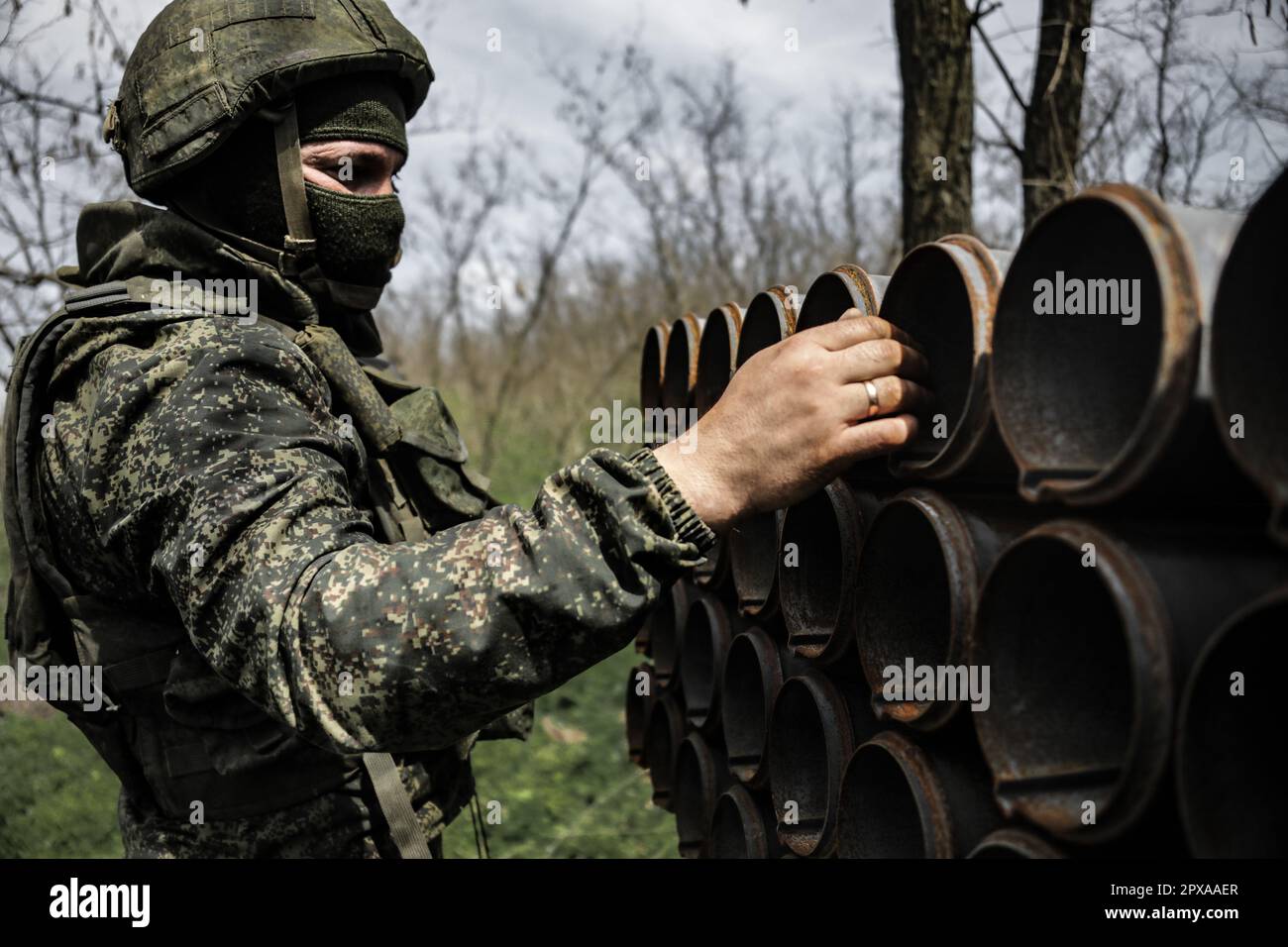 April 28.2023 Russia. Donetsk region. A soldier from the calculation of the multiple rocket ...