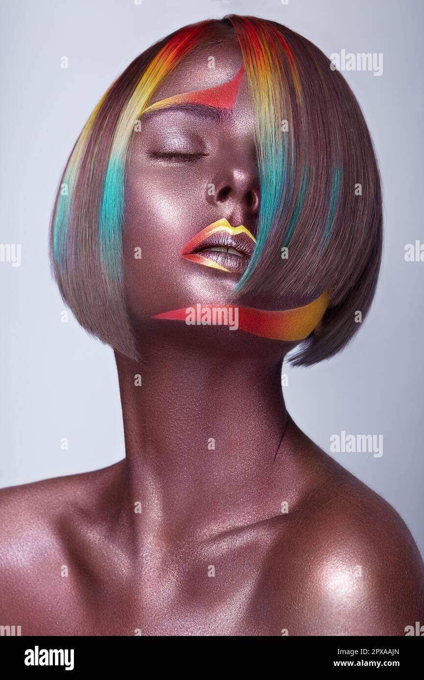 Beautiful girl with multi-colored hair and creative make up and ...