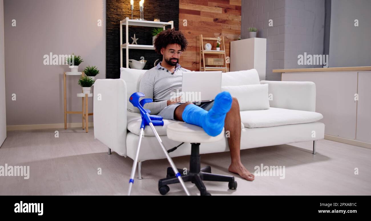 Injured Man With Broken Leg In Cast Stock Photo - Alamy