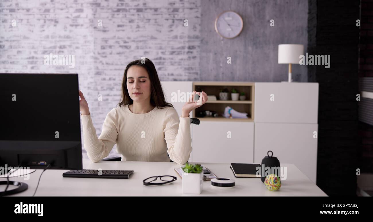Healthy Yoga Meditation Exercise In Office Chair At Workplace Stock ...
