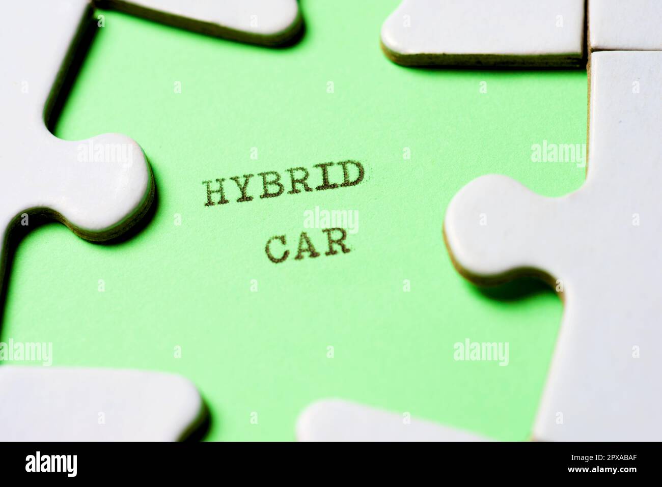 Hybrid car text written with a typewriter in a white puzzle Stock Photo ...