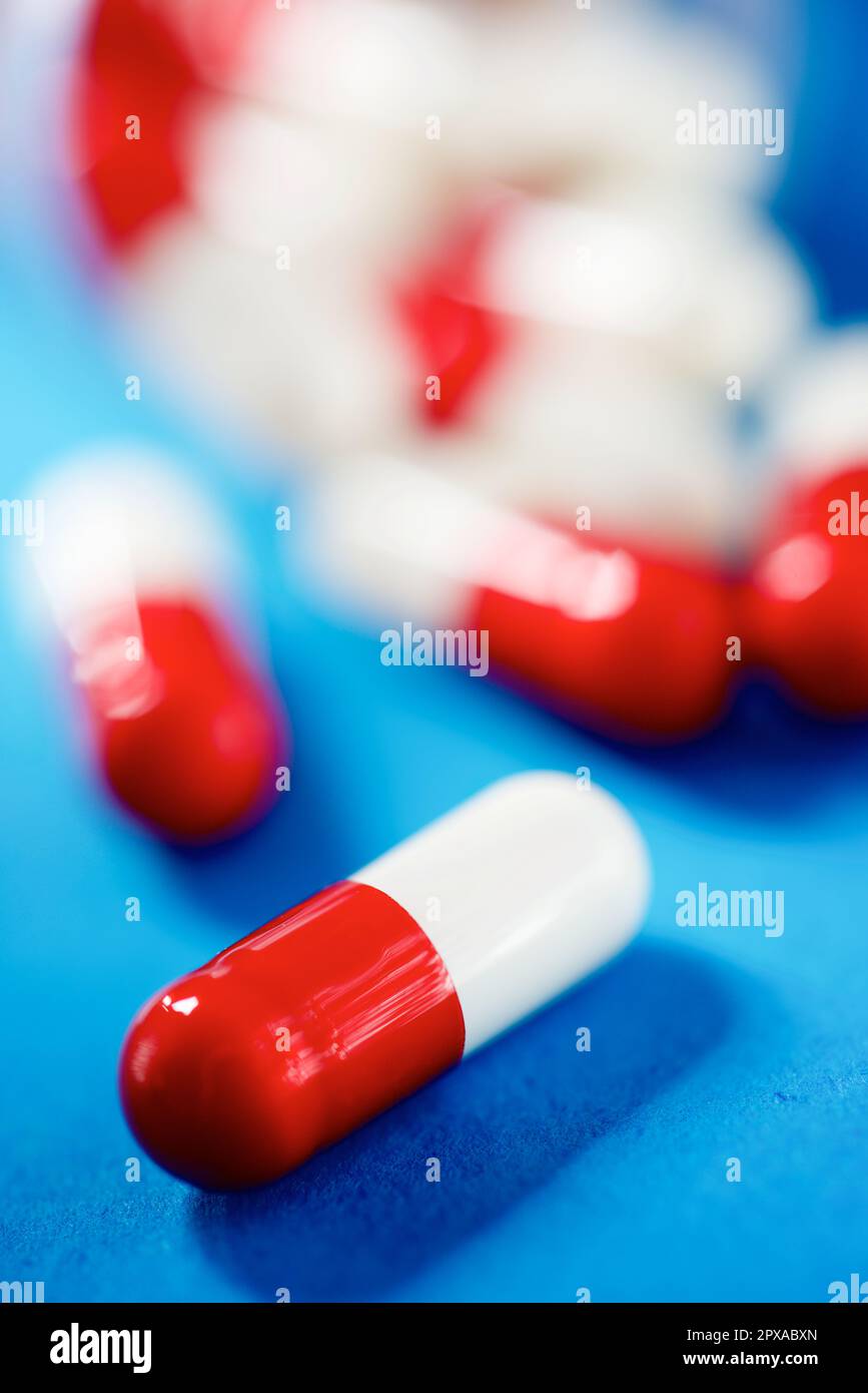Close-up of medication tablets coming out of a plastic canister Stock ...