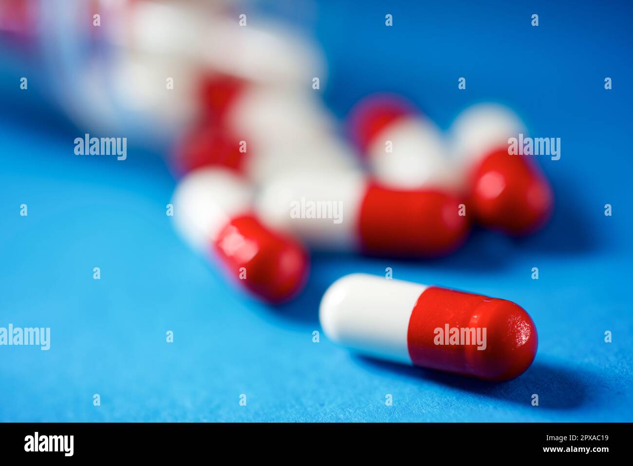 Close-up of medication tablets coming out of a plastic canister Stock ...