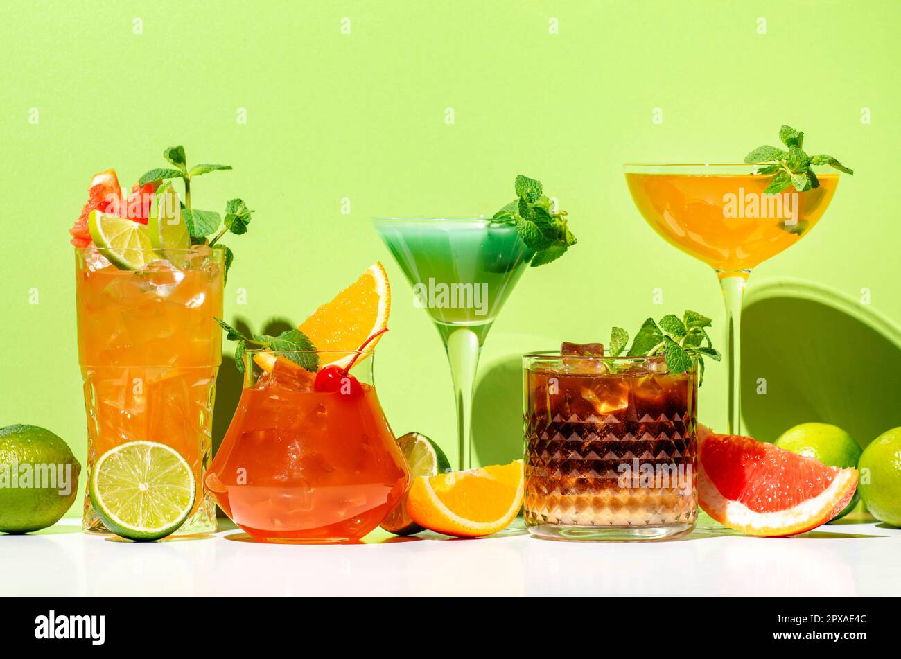 Alcoholic drinks with mint, summer cocktail party. Multi-colored low ...