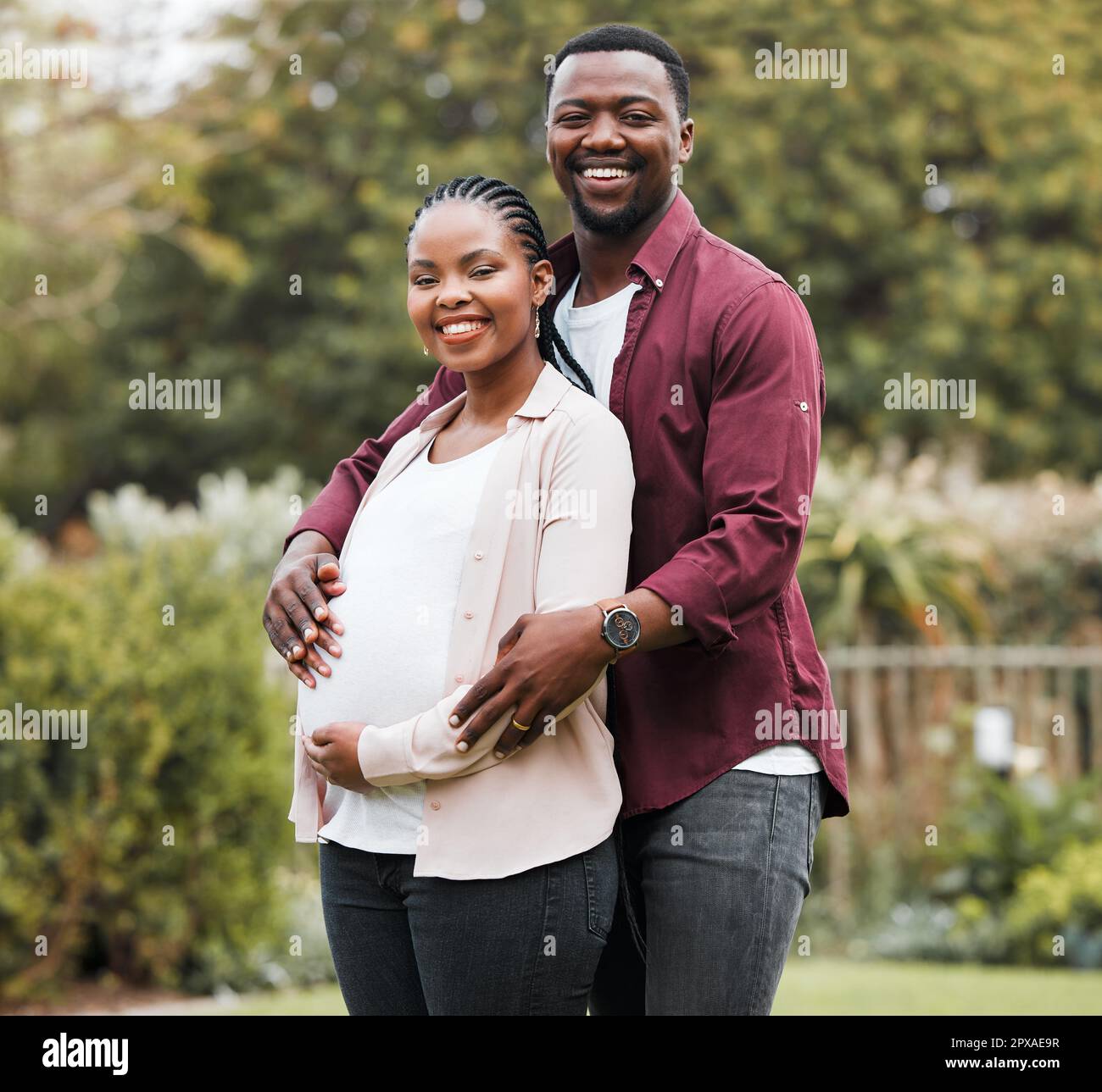 Holding the future in my hands. a young expecting couple posing ...