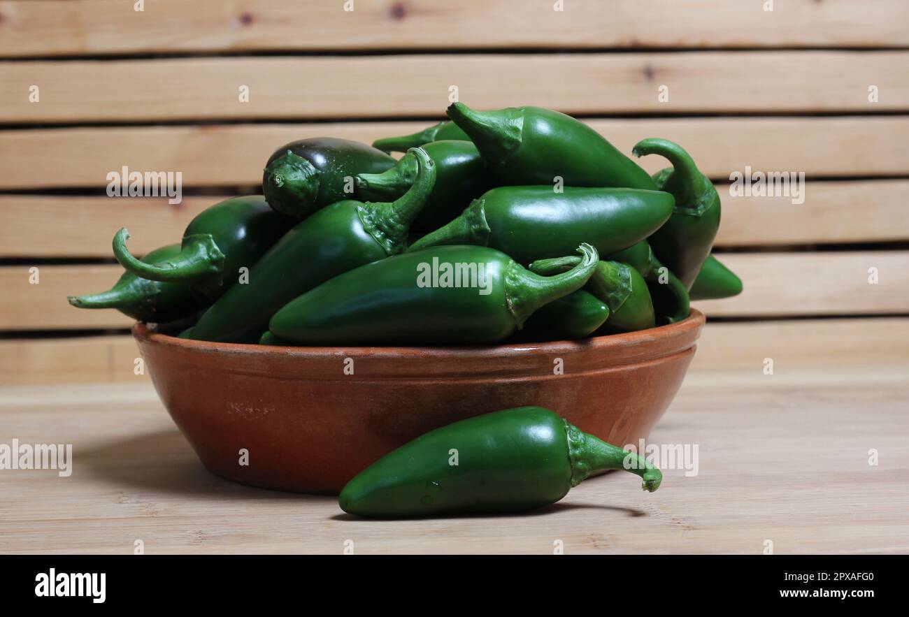 Bowl of Fresh Green Jalapeno Chili Peppers in Rustic Kitchen Stock ...