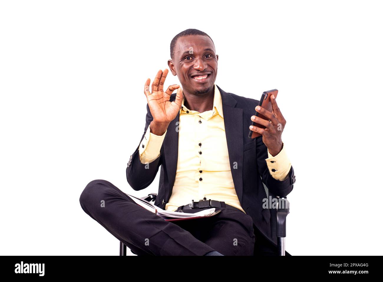businessman sitting on chair and showing correct gesture with fingers ...