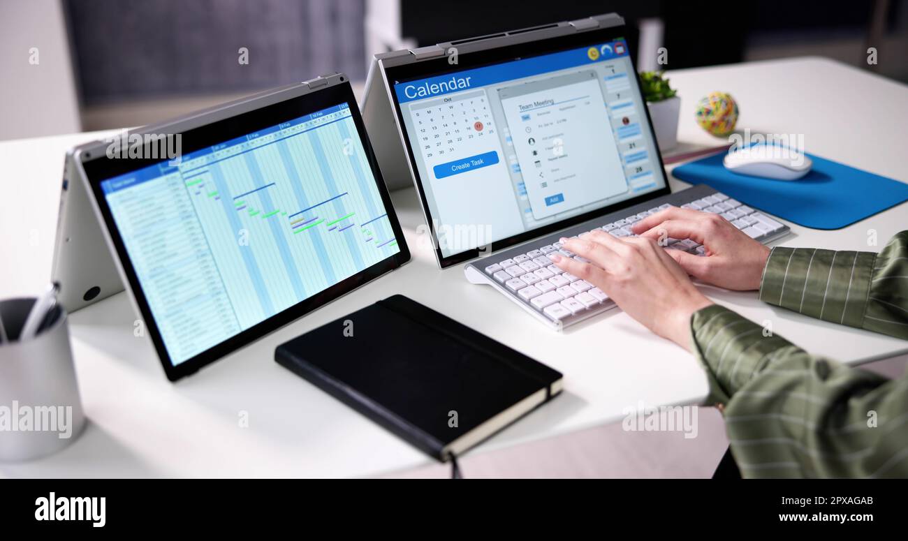 Employee Looking Calendar Schedule On Computer Screen Stock Photo - Alamy
