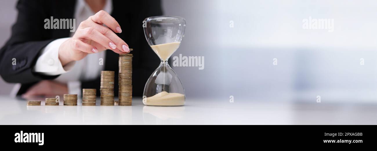 Increasing Money Coin Stack Concept. Hourglass And Time Stock Photo - Alamy