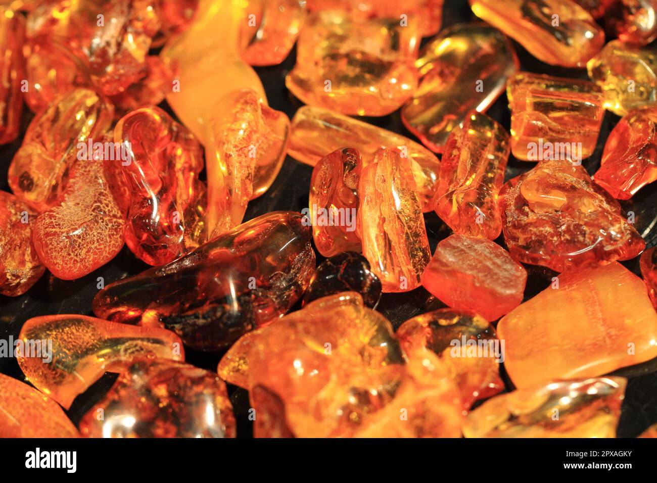 amber mineral gems texture as nice background Stock Photo - Alamy