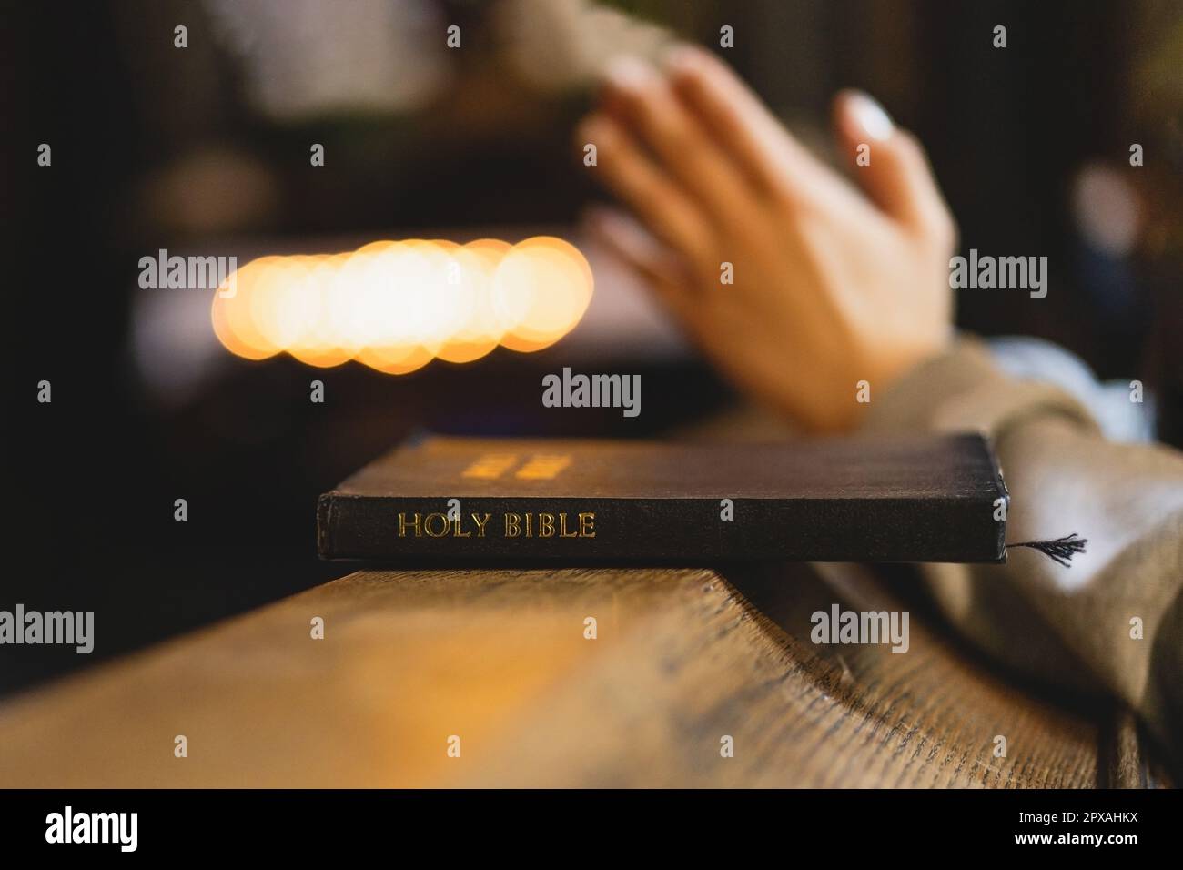 Christian woman reading bible in an ancient Catholic temple. Reading ...