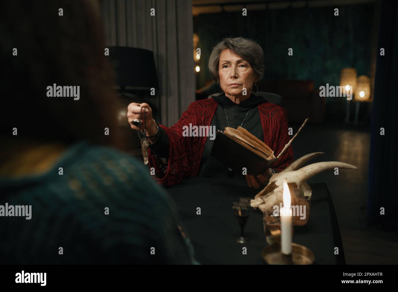 Gypsy forecaster reading spell for client using witchcraft book and ...