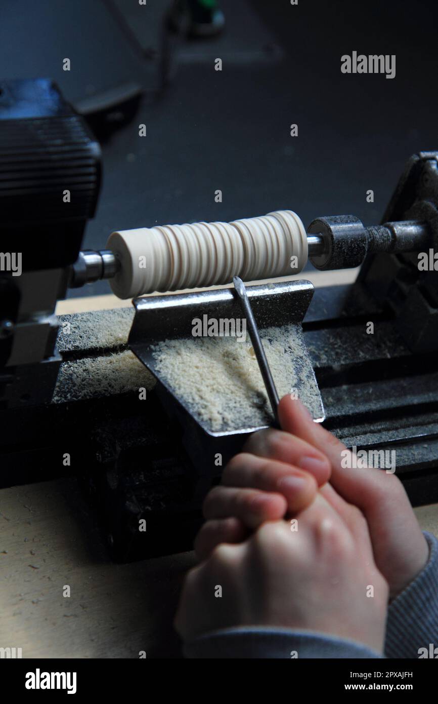 small wood-turning lathe for small wooden toys Stock Photo - Alamy